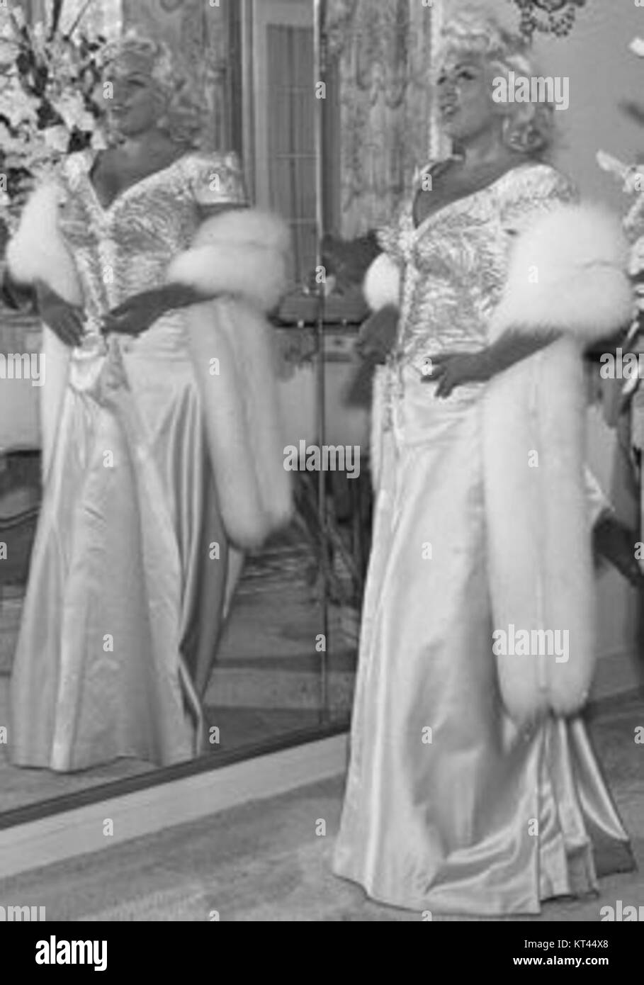Mae West, an iconic American actress and comedian, is captured here in ...