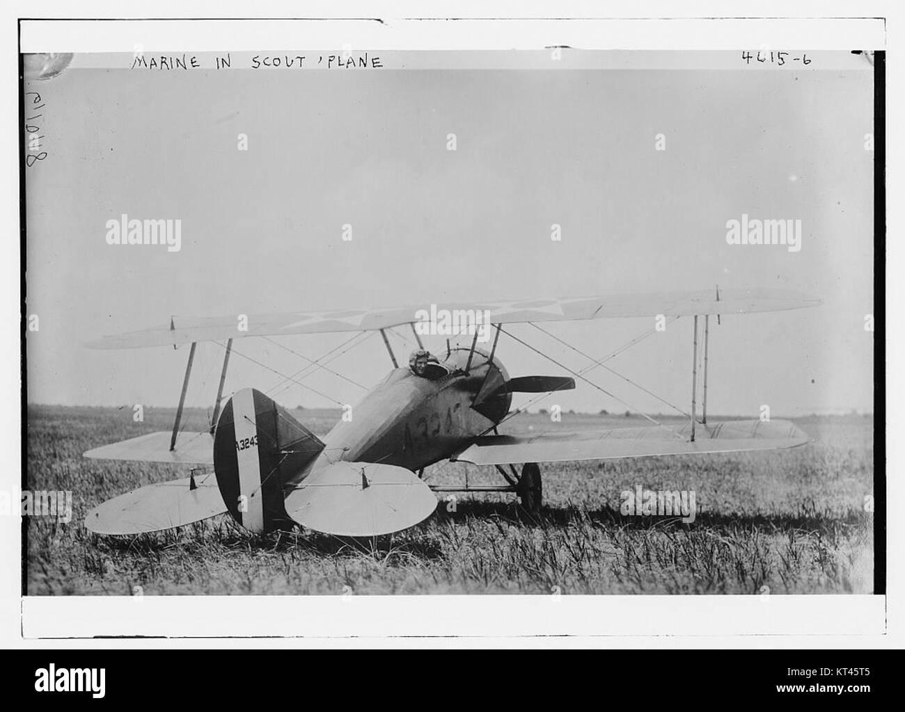 This image shows a U.S. Marine pilot in a scout plane, likely from the ...