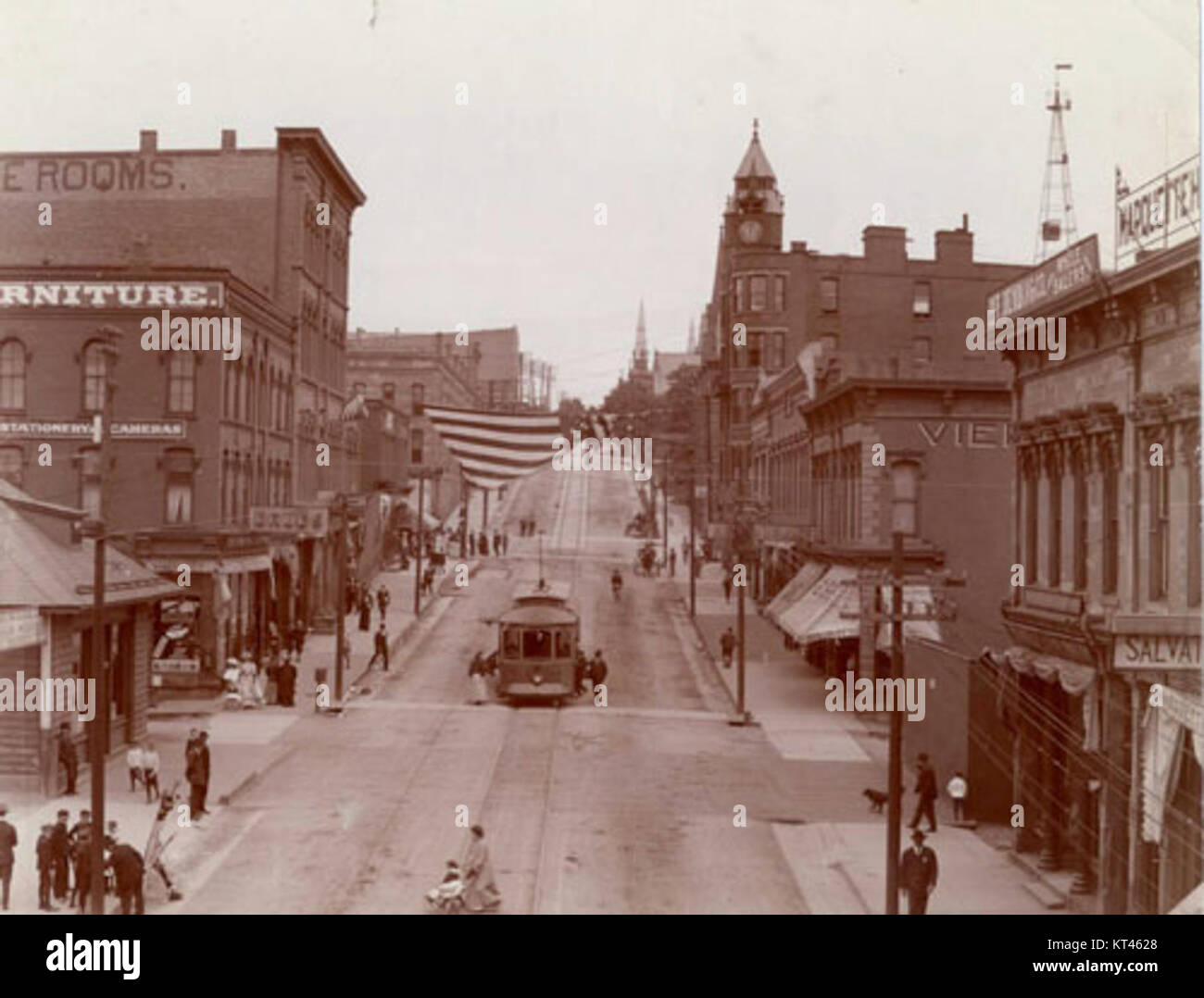A historical photograph of Front Street in Marquette, Michigan, from ...