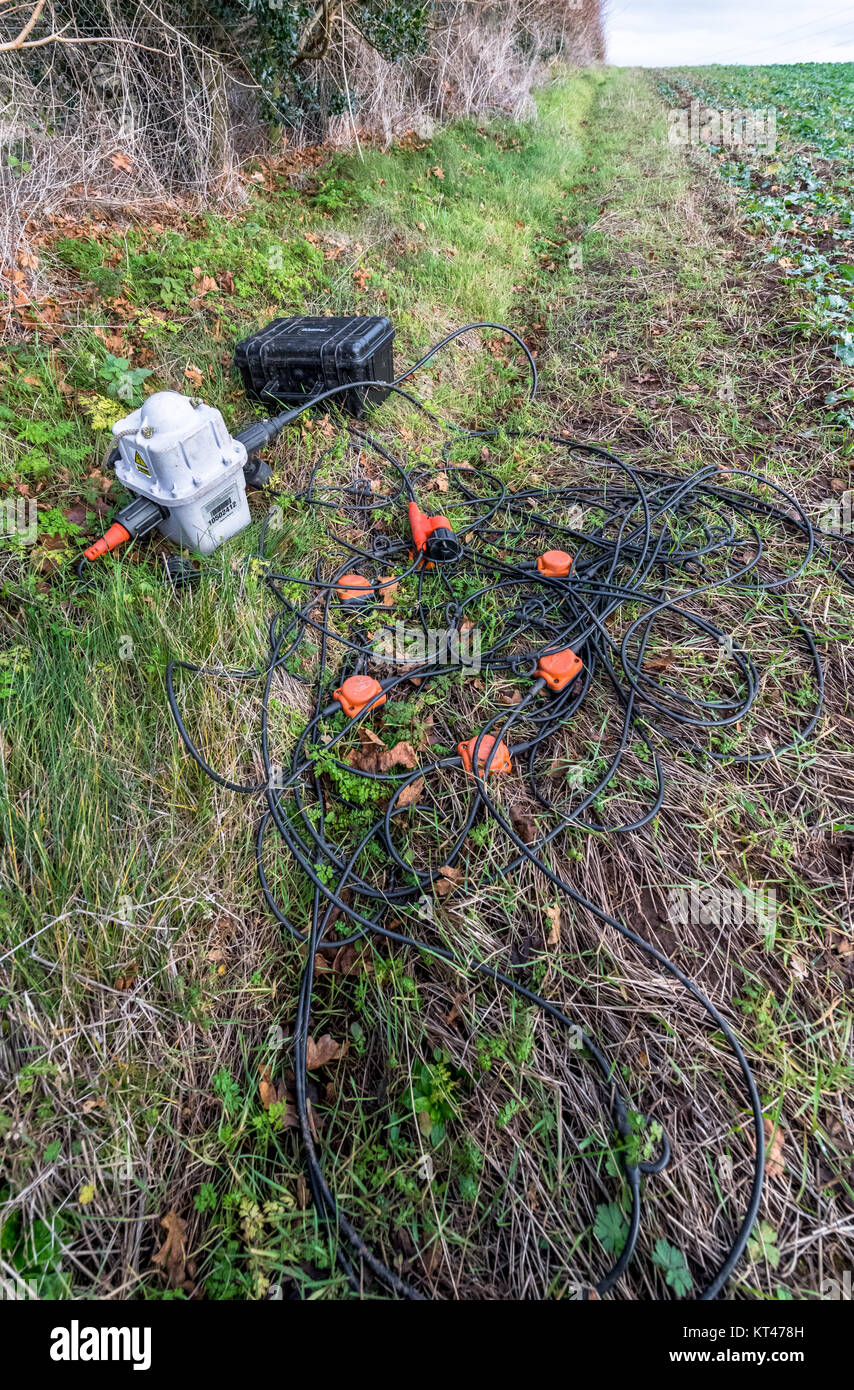 Seismic geophones and recording units at the side of a arable field ...