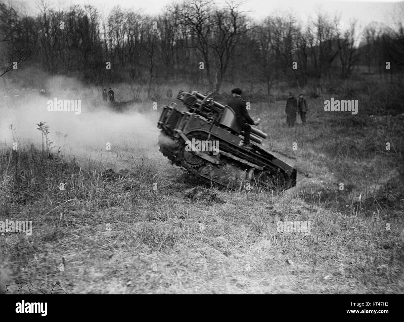 This image shows a military vehicle in a field, likely a reference to ...