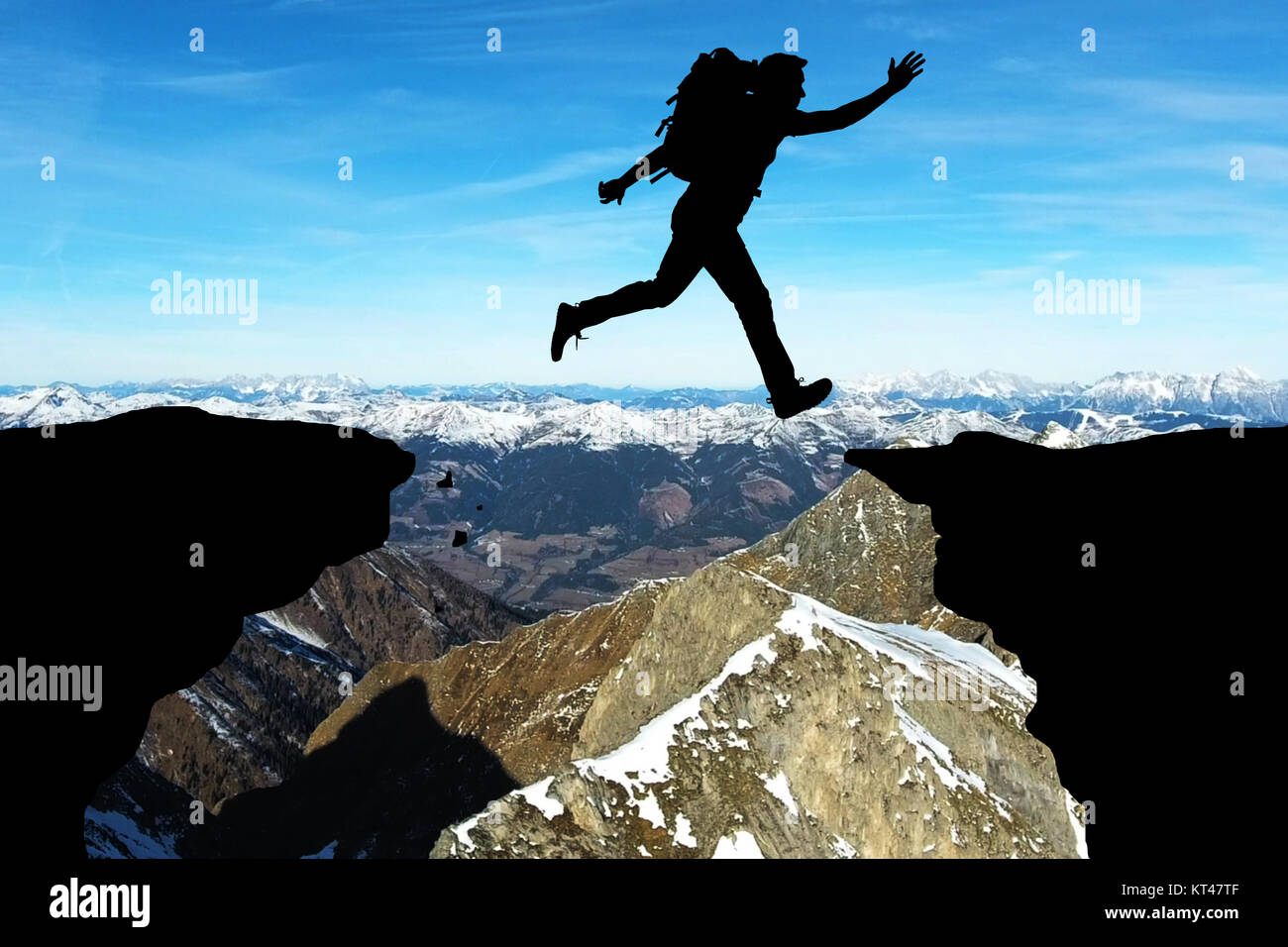 Man Jumping Over Rocky Mountain Stock Photo - Alamy