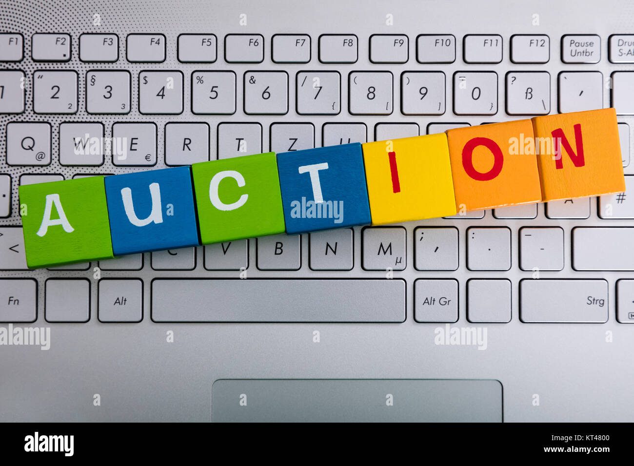 Auction Word On Cubes Over Laptop Stock Photo - Alamy