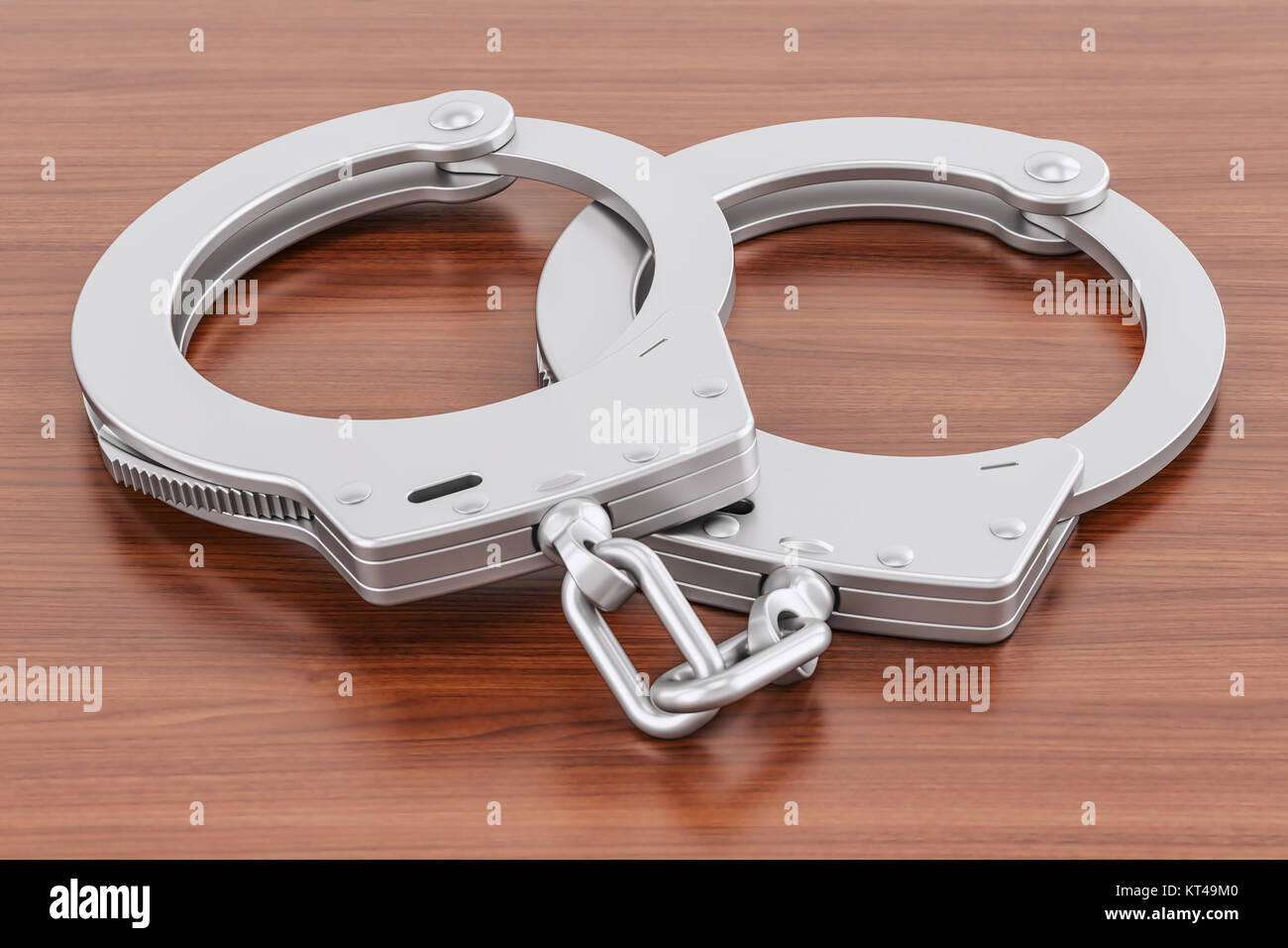 Handcuffs on the wooden table, 3D rendering Stock Photo - Alamy
