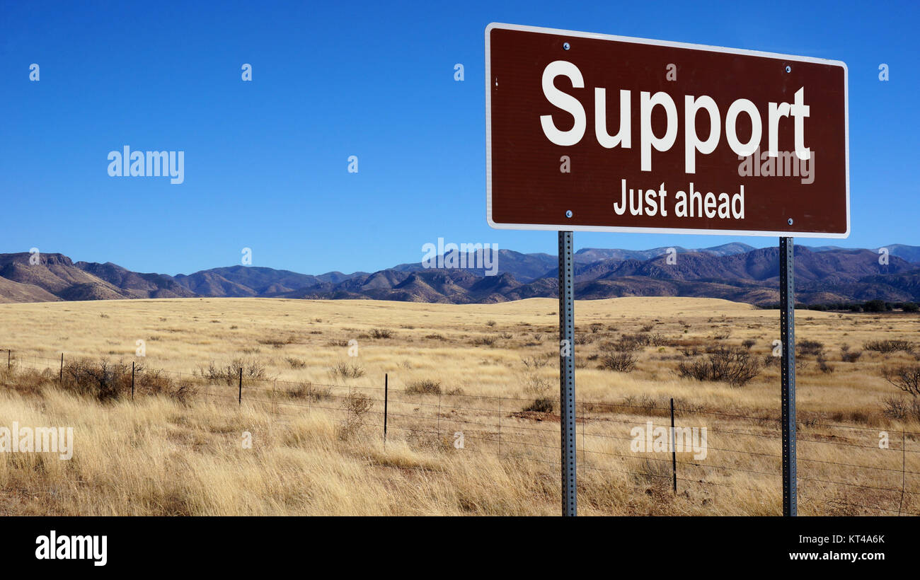 Support brown road sign Stock Photo - Alamy