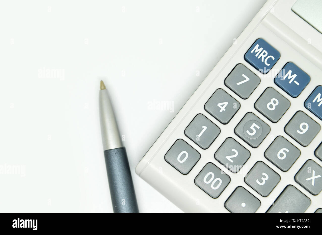 Calculator and pen isolated on white Stock Photo - Alamy