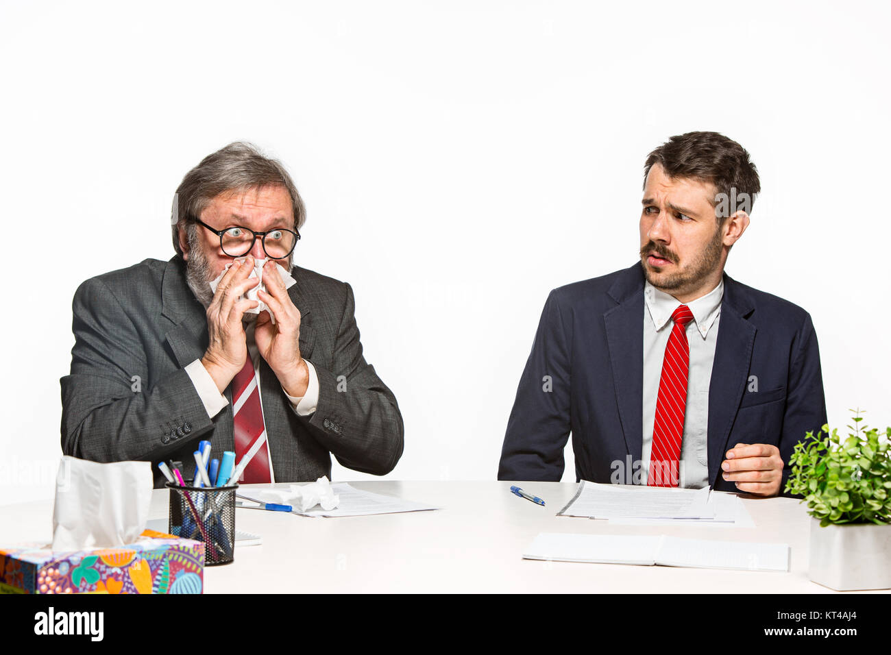 The two colleagues working together at office on white background Stock ...