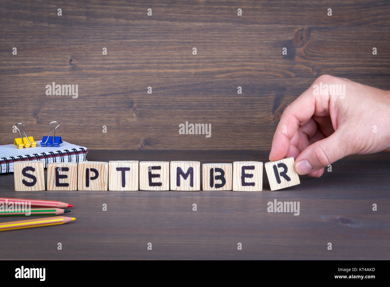 september. Wooden letters on the office desk, informative and ...