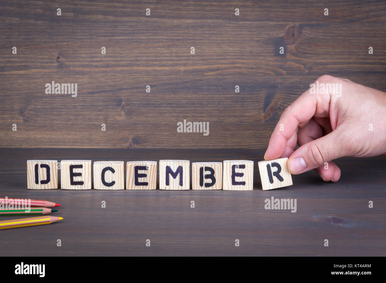 december. Wooden letters on the office desk, informative and ...