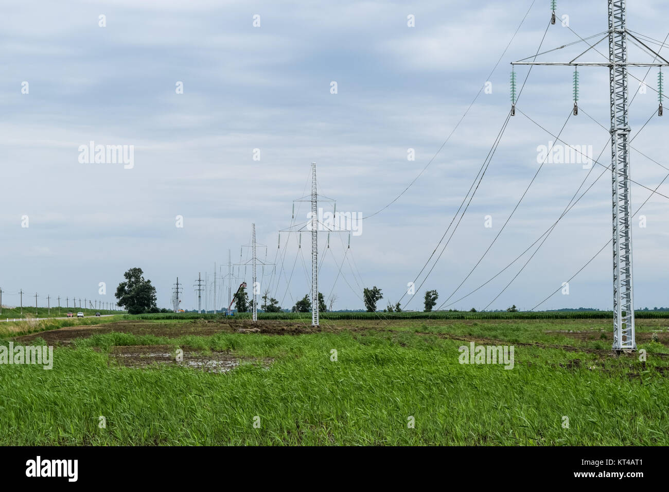 Assembly and installation of new support of a power line Stock Photo ...