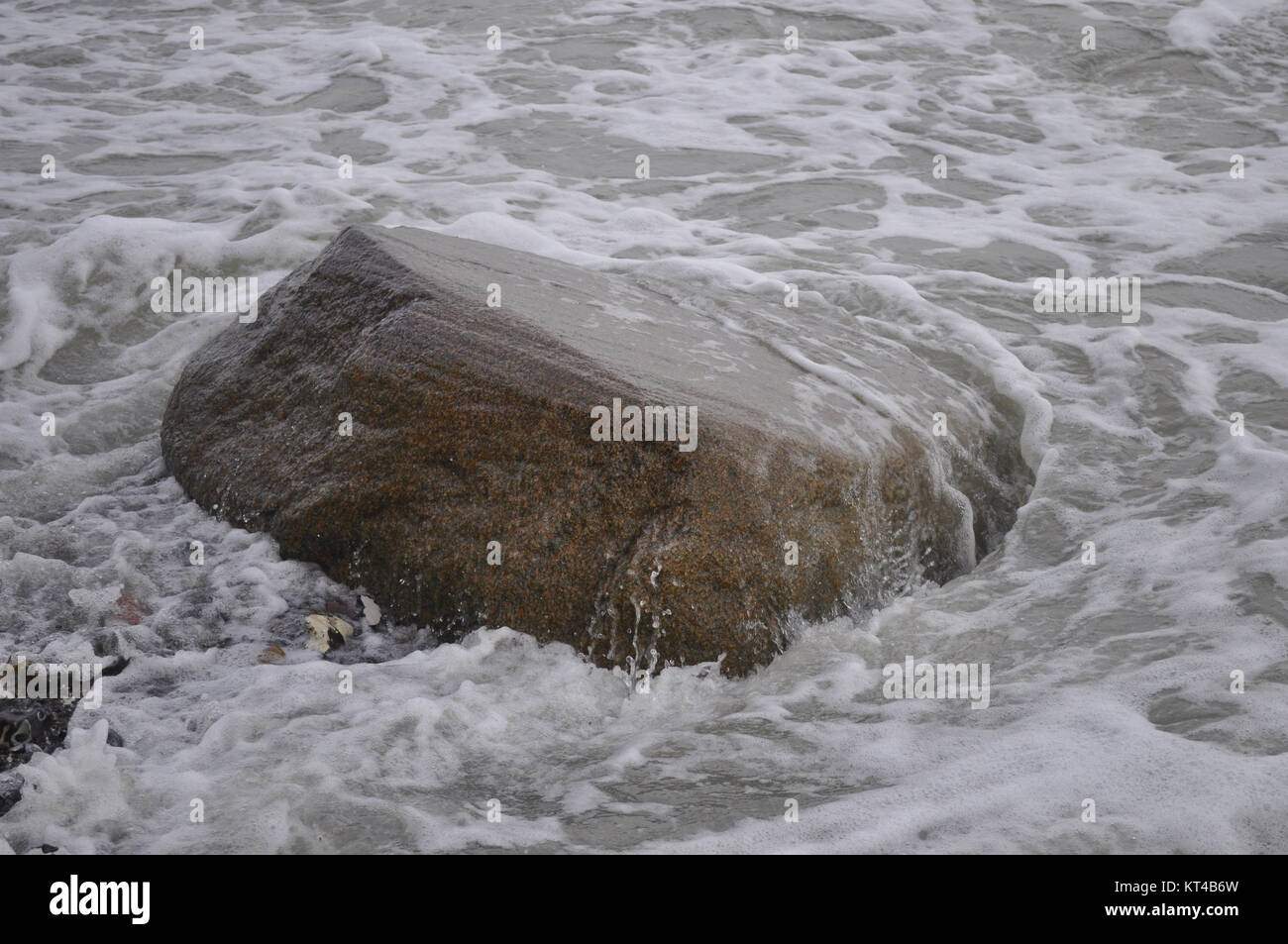 stone in the sea Stock Photo - Alamy