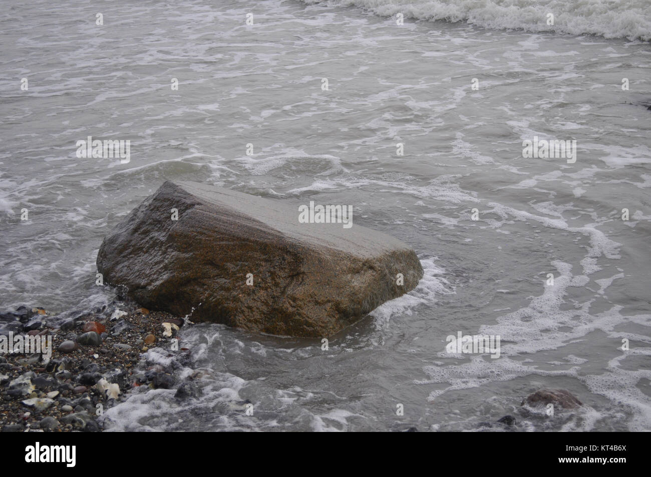 stone in the sea Stock Photo - Alamy