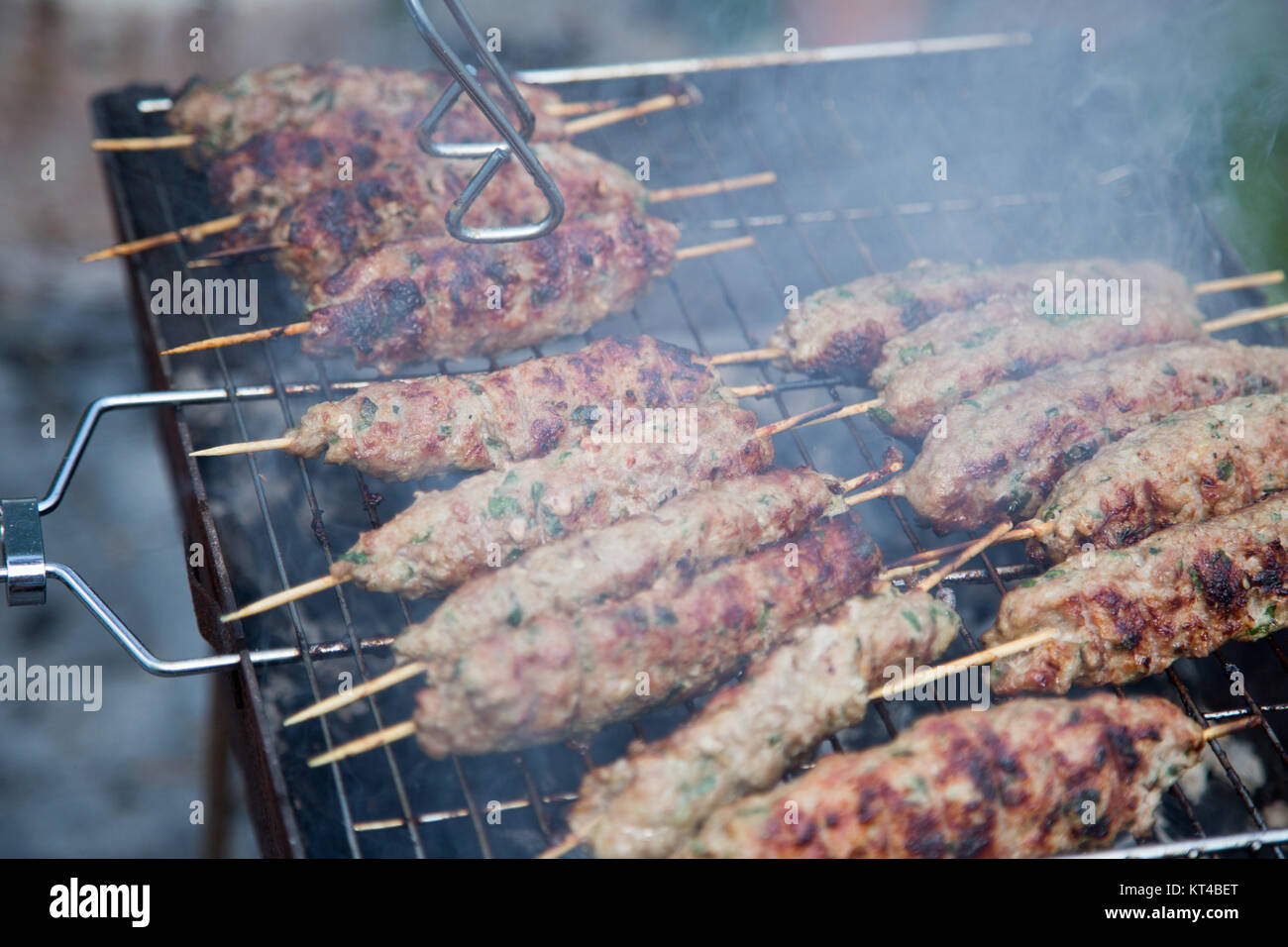 Cooking of lula kebab on the grill at picnic Stock Photo - Alamy