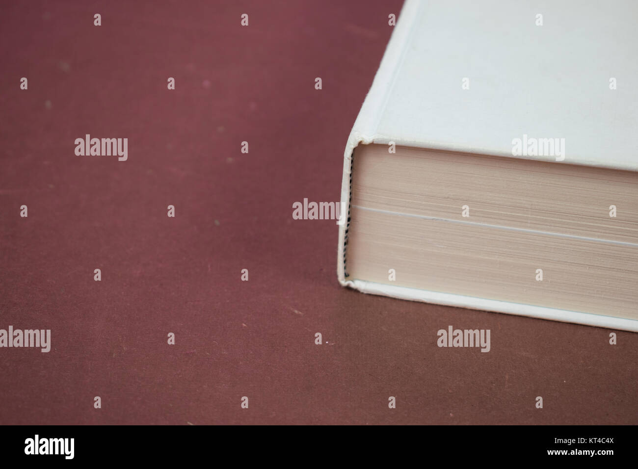 White blank hardcover book on red background Stock Photo - Alamy