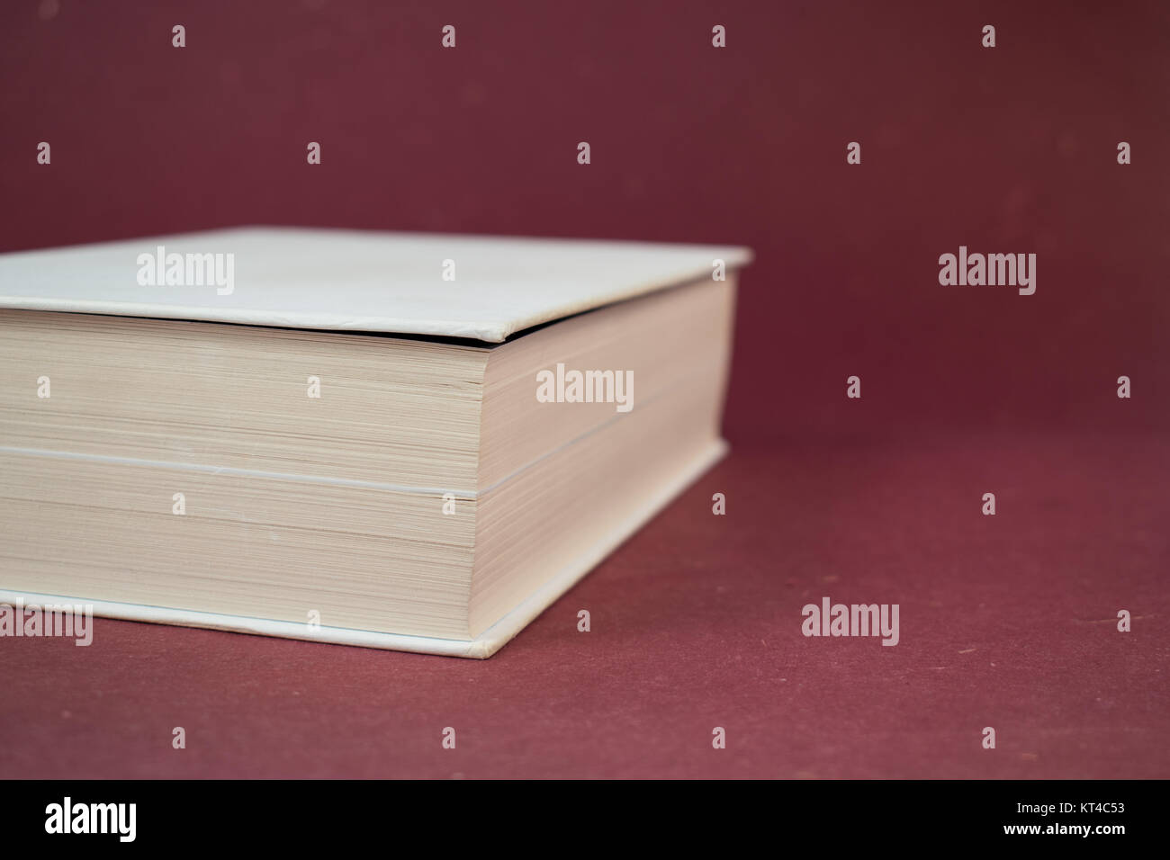 White blank hardcover book on red background Stock Photo - Alamy
