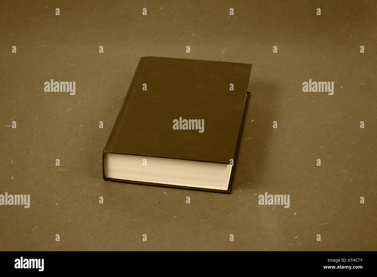 Big closed hardcover book. Sepia image Stock Photo - Alamy