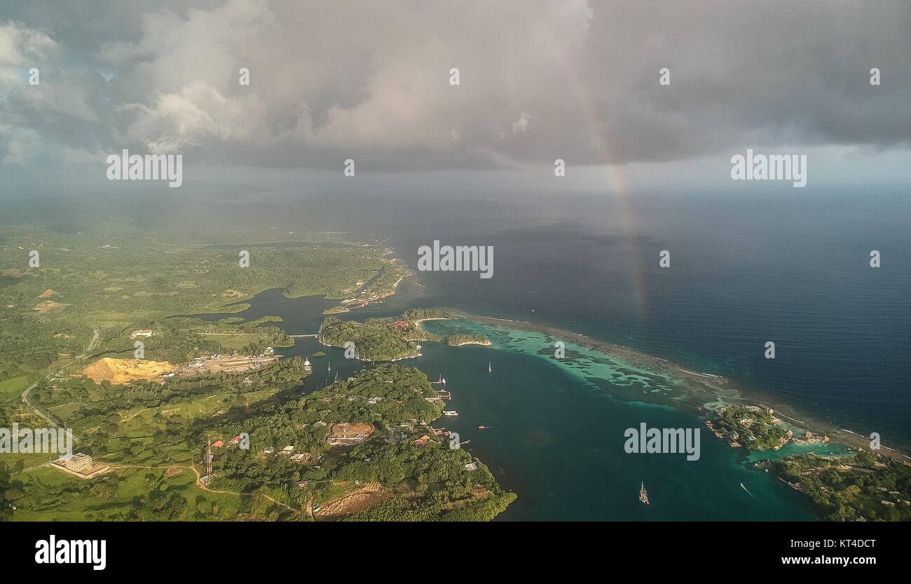 Rainbow Over Caribbean Island Stock Photo - Alamy