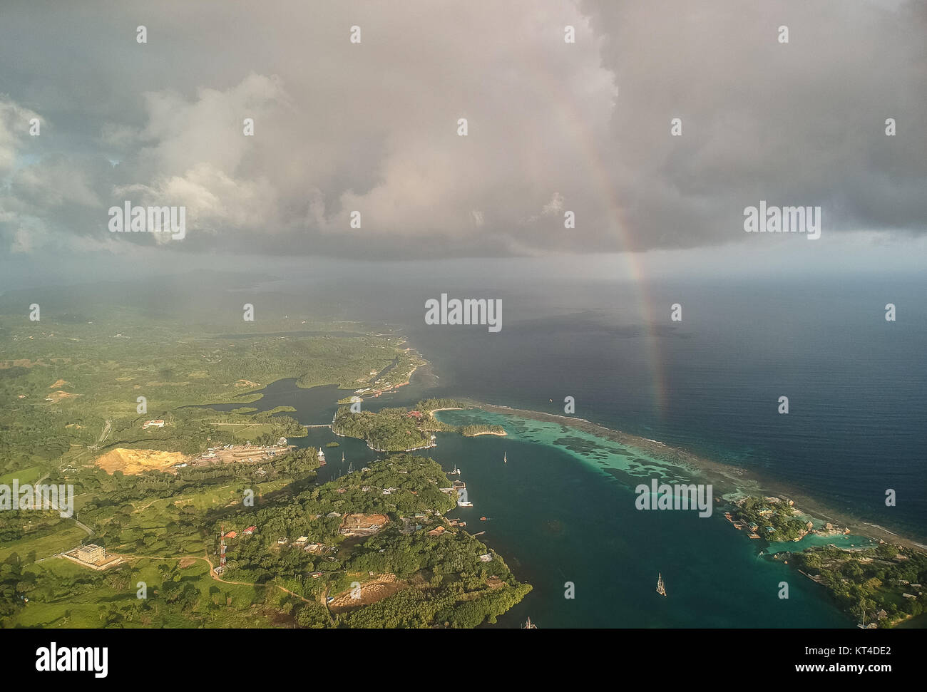 Rainbow Over Caribbean Island Stock Photo - Alamy
