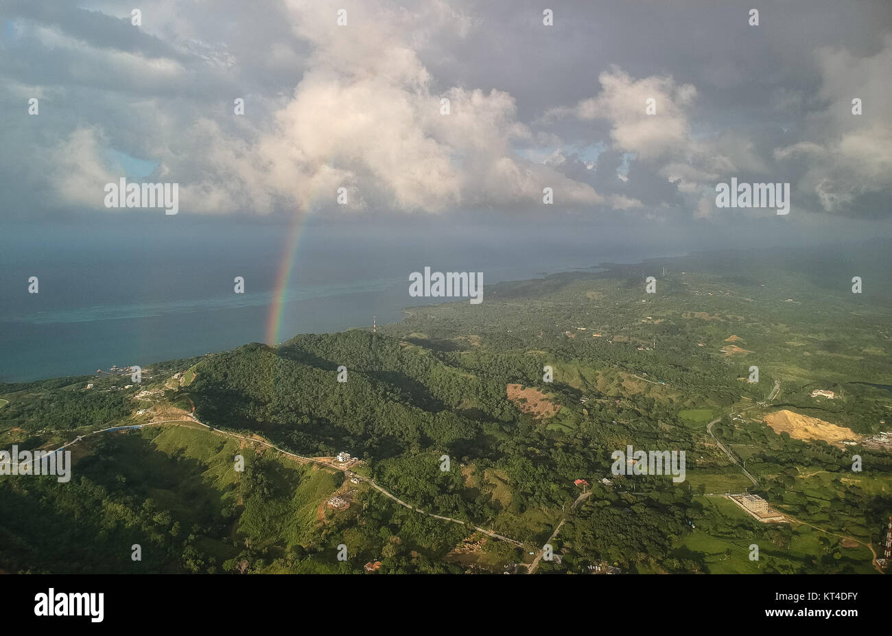 Rainbow Over Caribbean Island Stock Photo - Alamy