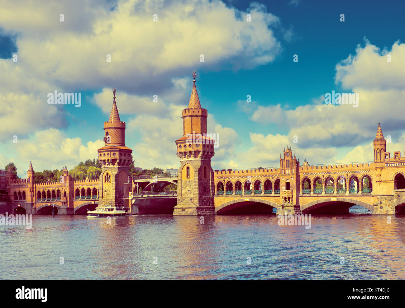 Oberbaumbruecke in Berlin on a bright sunny day with sun and clouds ...
