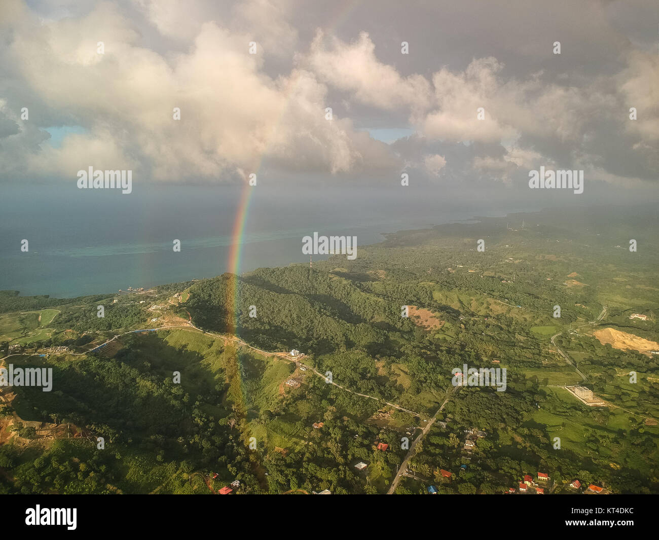 Rainbow Over Caribbean Island Stock Photo - Alamy