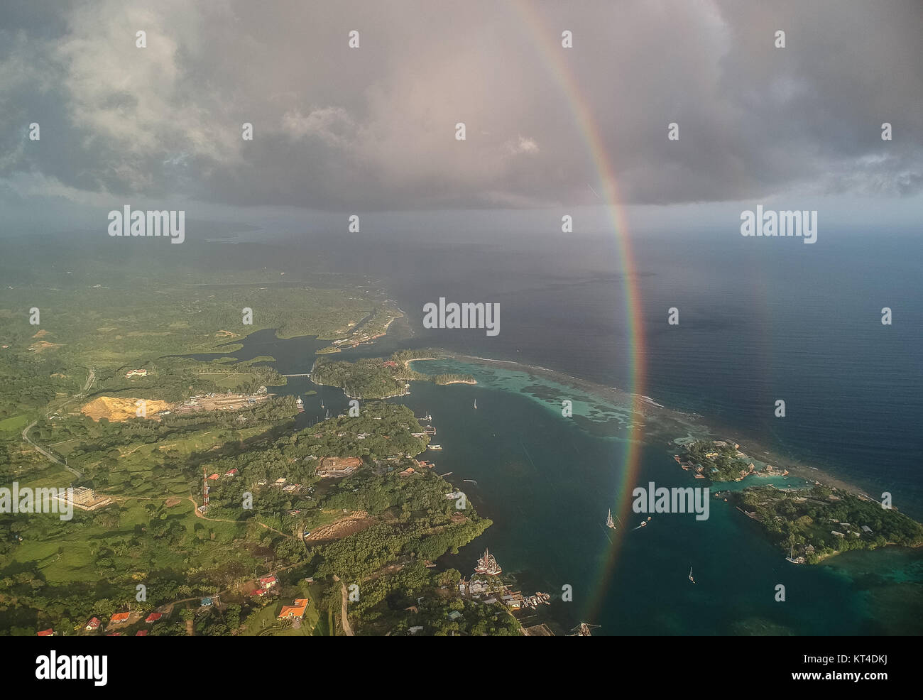 Rainbow Over Caribbean Island Stock Photo - Alamy