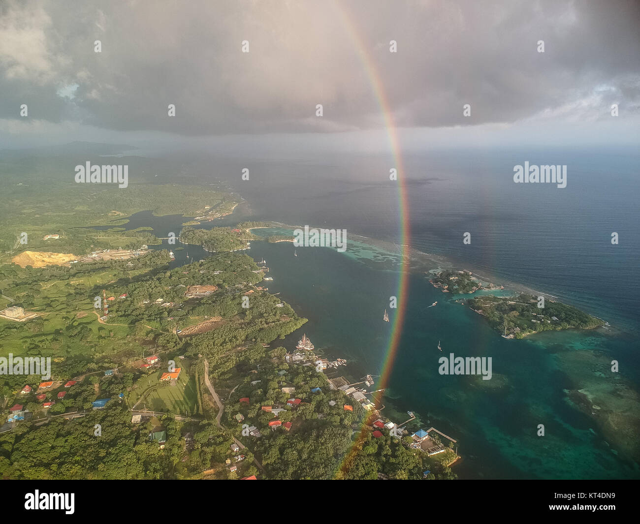 Rainbow Over Caribbean Island Stock Photo - Alamy