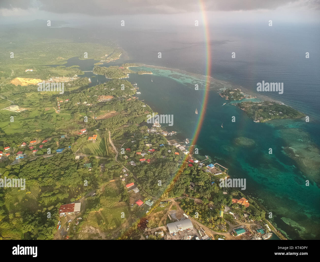 Rainbow Over Caribbean Island Stock Photo - Alamy