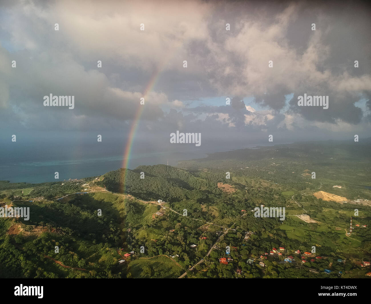 Rainbow Over Caribbean Island Stock Photo - Alamy