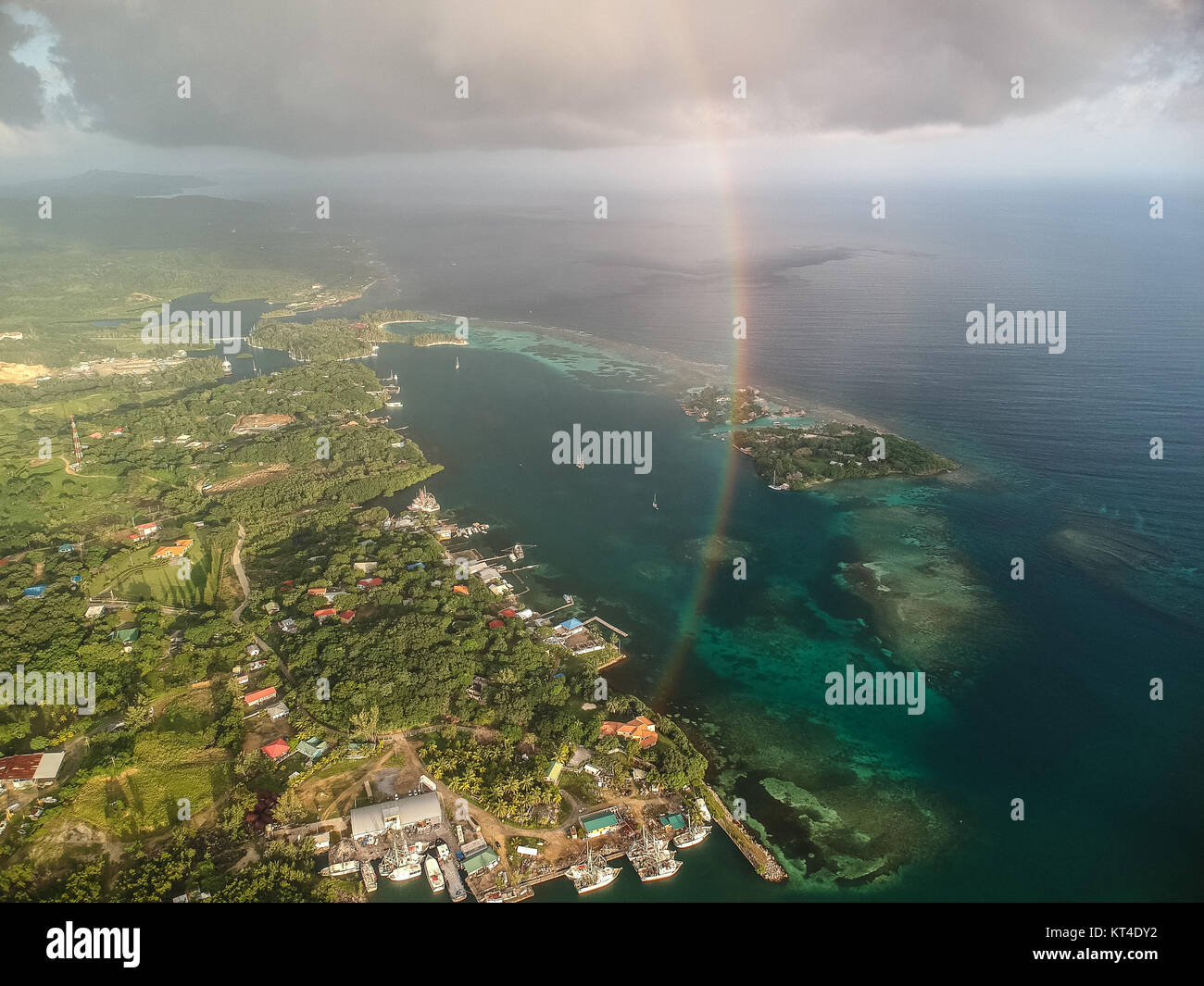 Rainbow Over Caribbean Island Stock Photo - Alamy