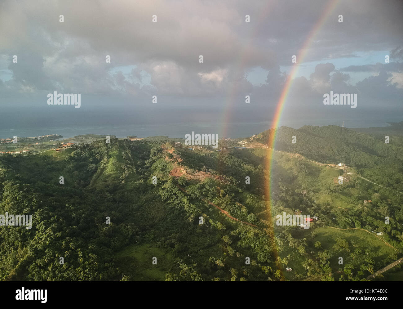 Rainbow Over Caribbean Island Stock Photo - Alamy