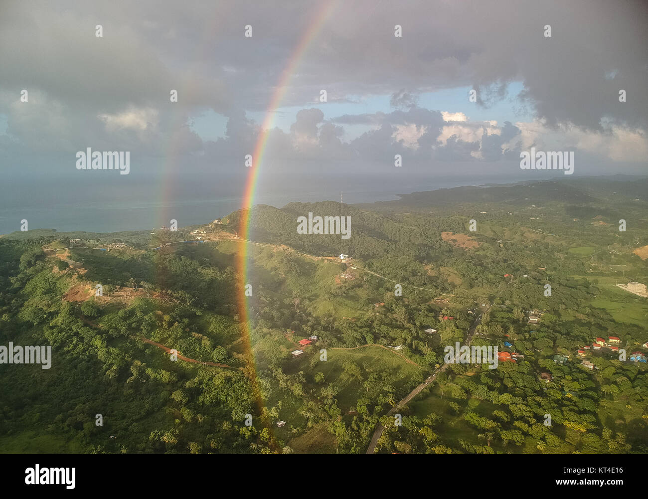 Rainbow Over Caribbean Island Stock Photo - Alamy