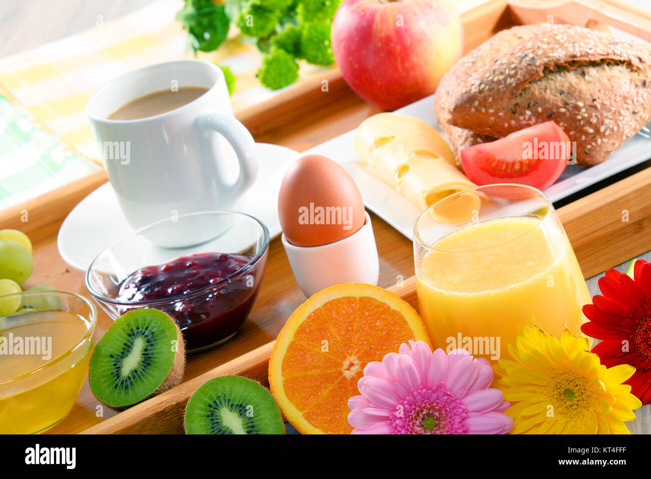 Breakfast on tray served with coffee, juice, egg, and rolls Stock Photo ...