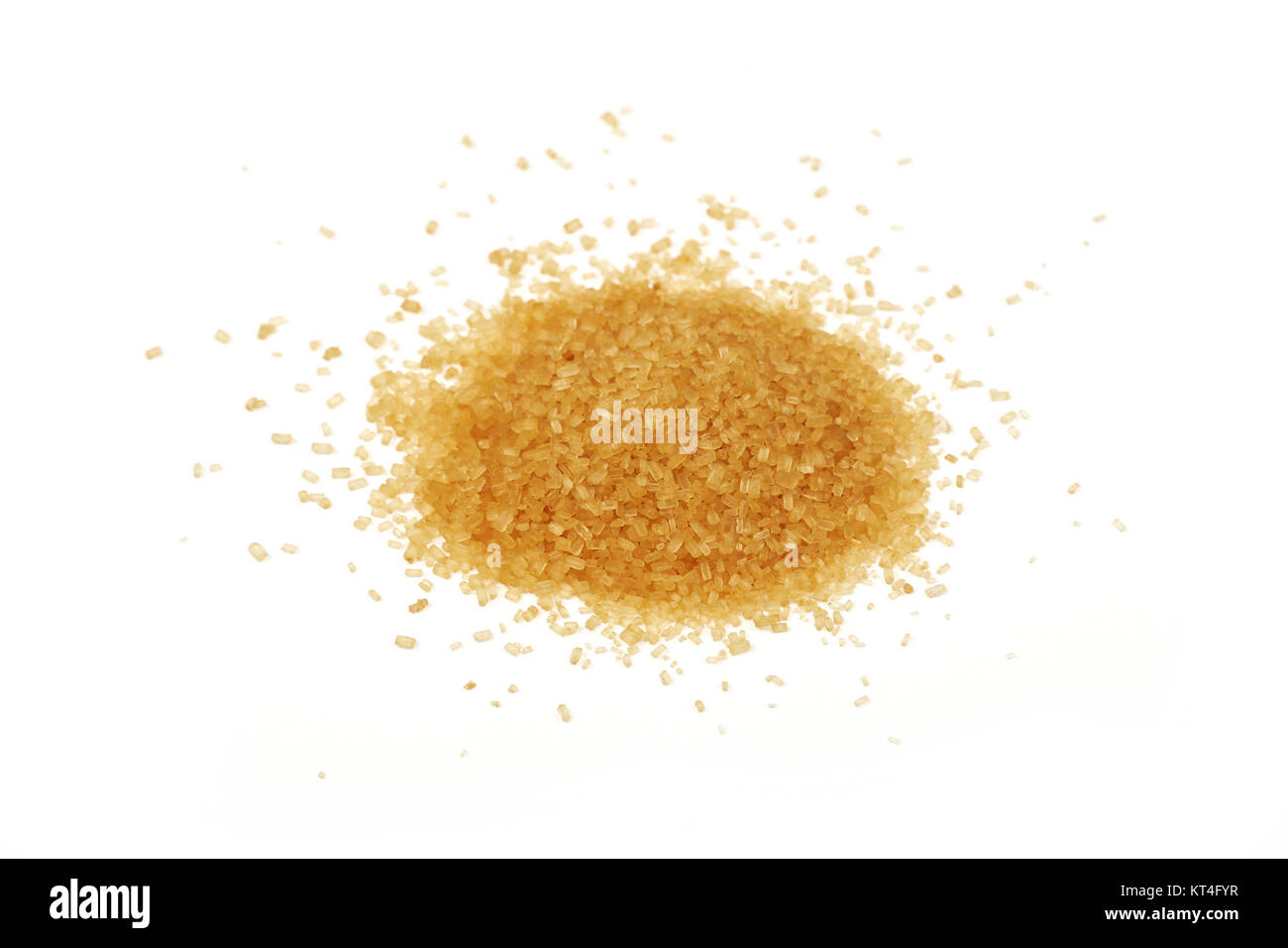 Pinch of brown cane sugar spilled on white Stock Photo - Alamy