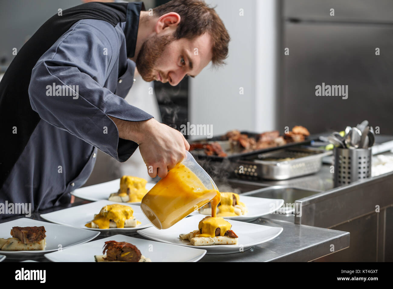 Chef Pours A Gamy Sauce Stock Photo Alamy chef-pours-a-gamy-sauce-stock-photo-alamy