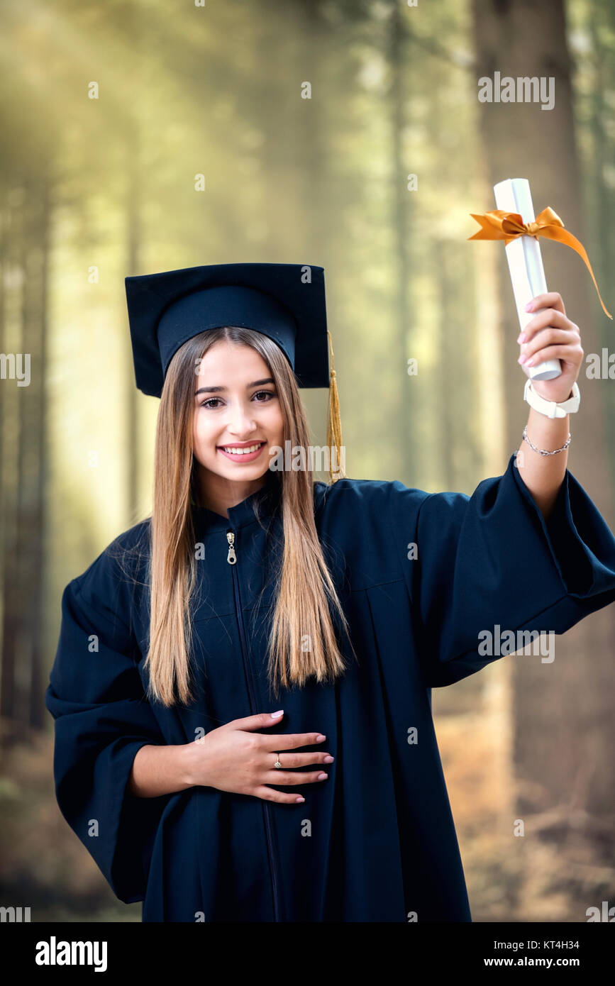 Graduation: Student Standing With Diploma Stock Photo - Alamy