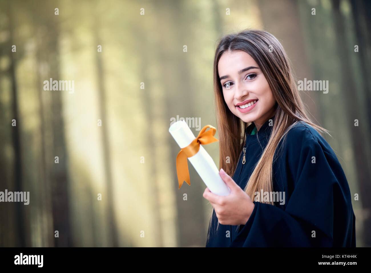 Graduation: Student Standing With Diploma Stock Photo - Alamy