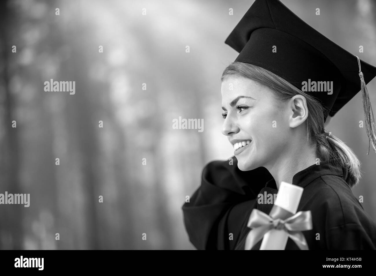 Graduation: Student Standing With Diploma Stock Photo - Alamy