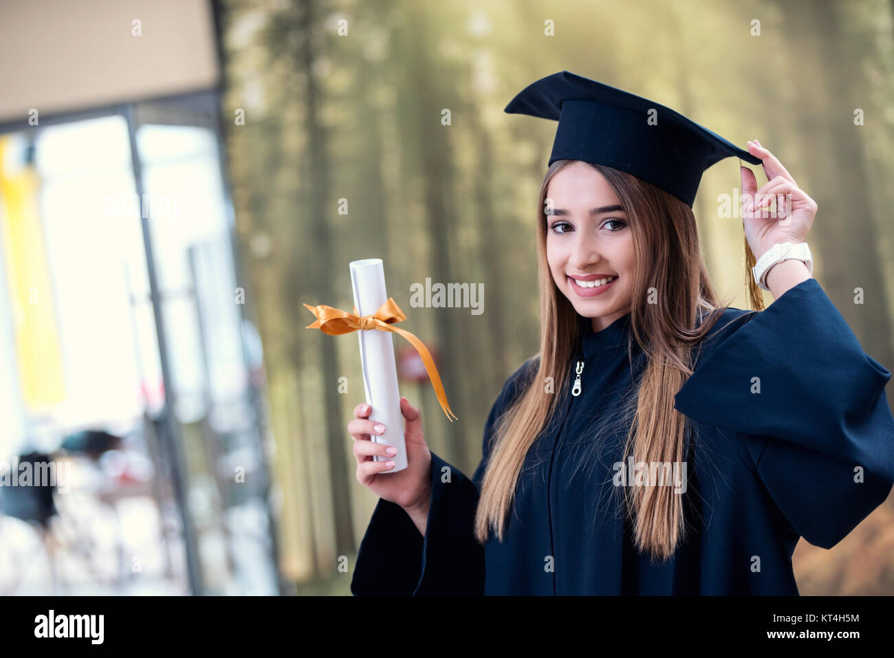 Graduation: Student Standing With Diploma Stock Photo - Alamy