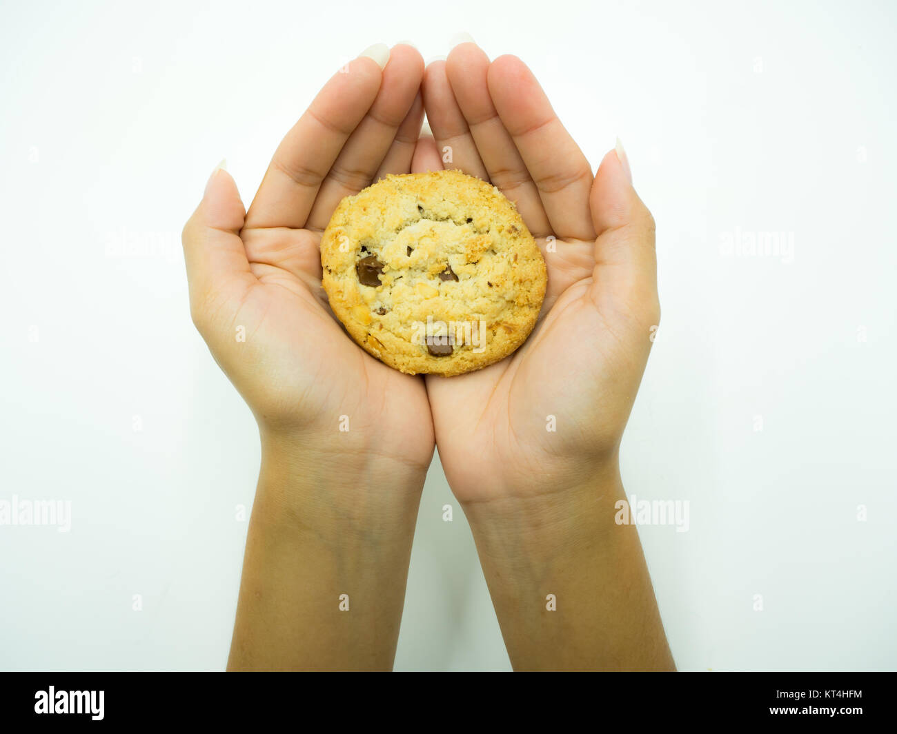 Woman eating chocolate biscuit close hi-res stock photography and ...