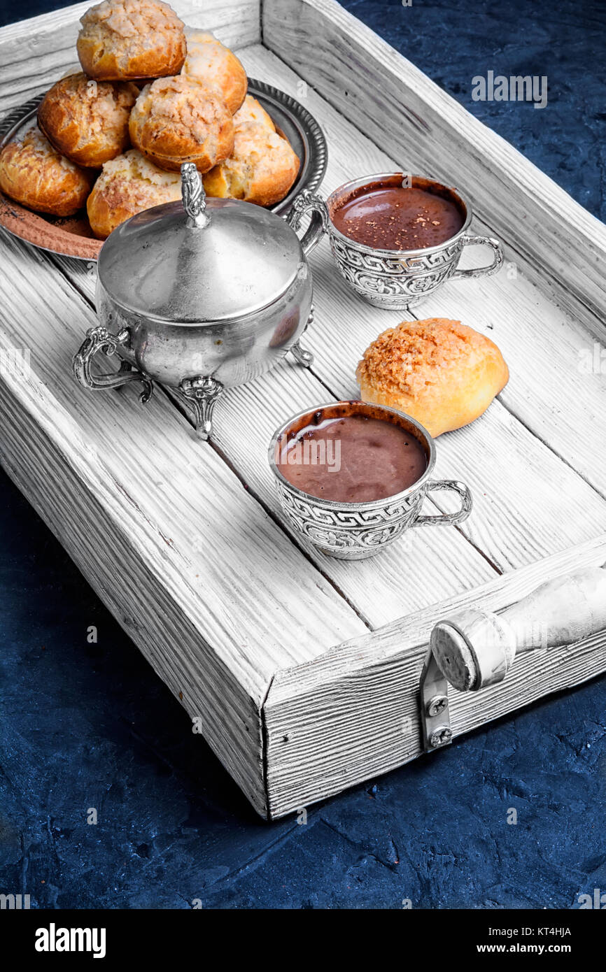 Homemade profiteroles dessert and cup hot chocolate Stock Photo - Alamy