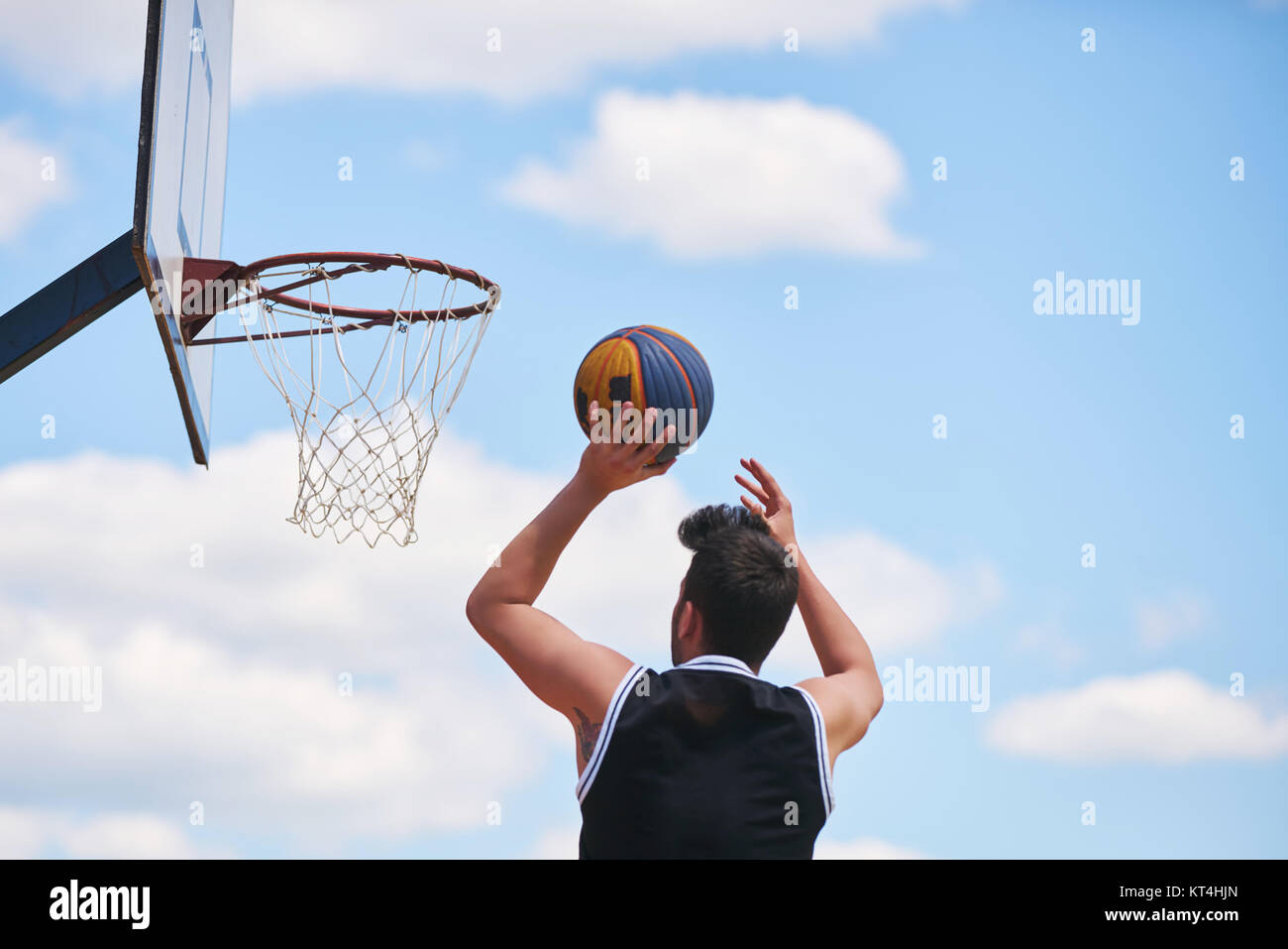 Basketball player in action flying high and scoring Stock Photo - Alamy