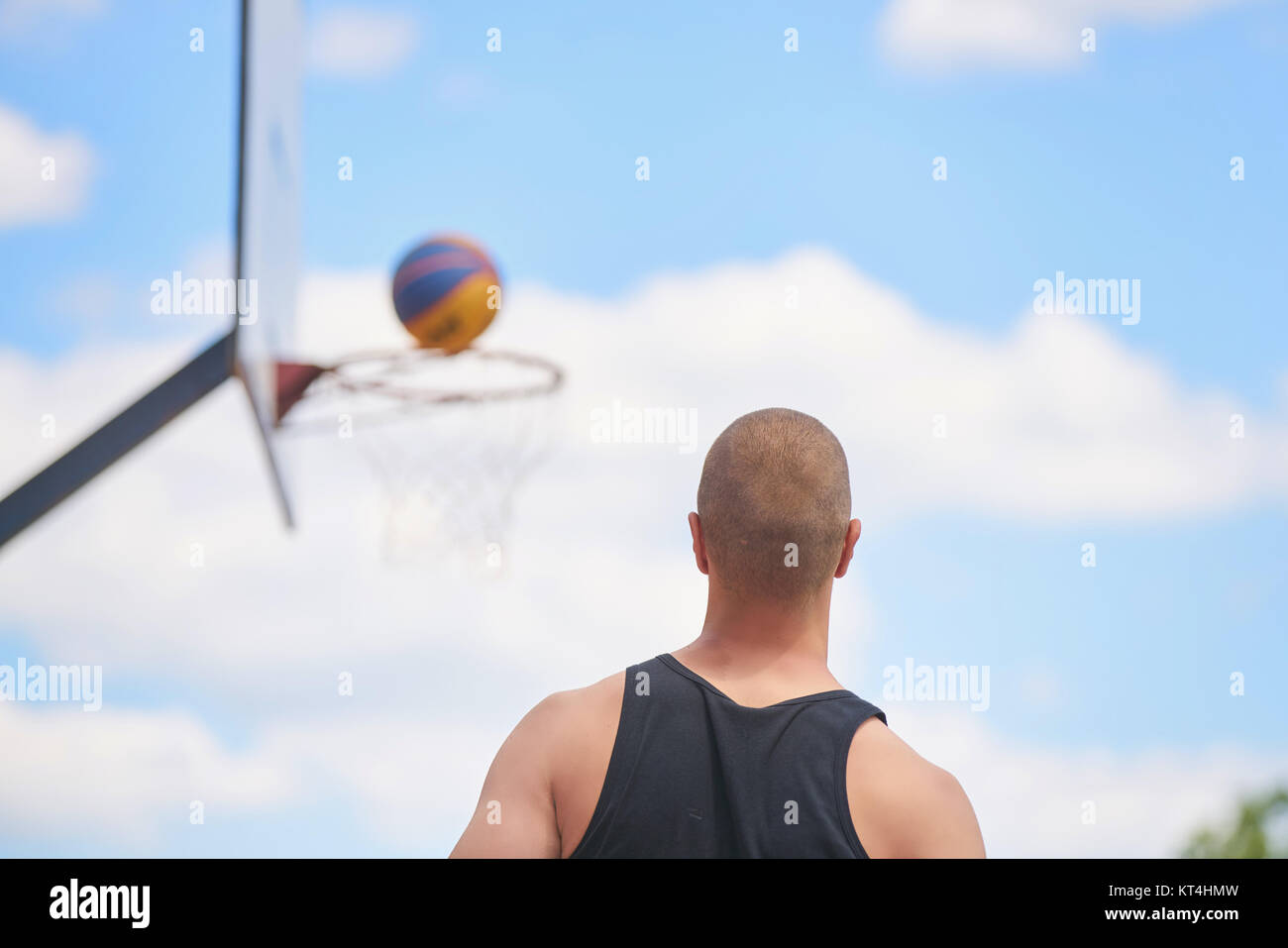 Basketball player in action flying high and scoring Stock Photo - Alamy
