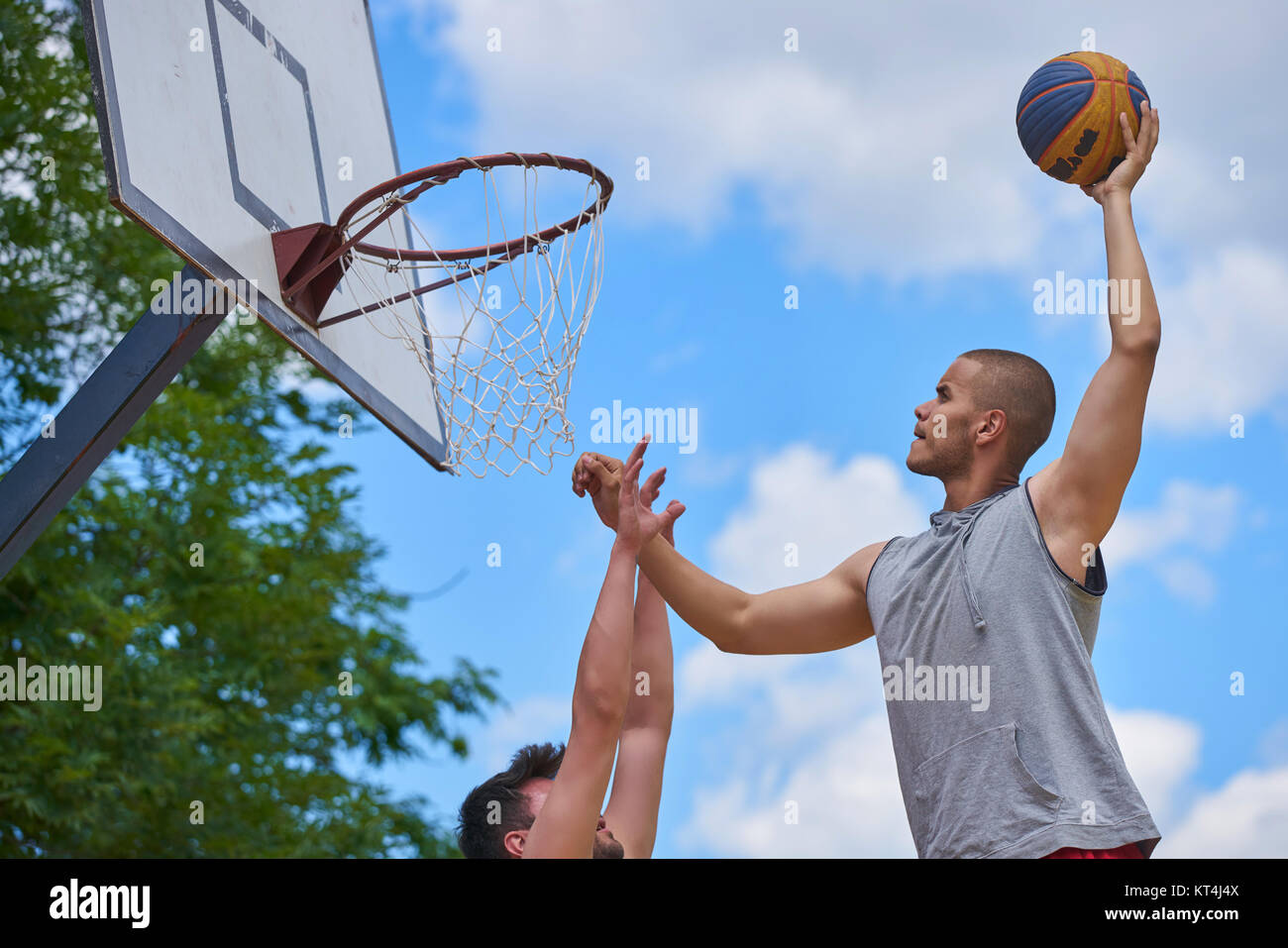 Basketball player in action flying high and scoring Stock Photo - Alamy