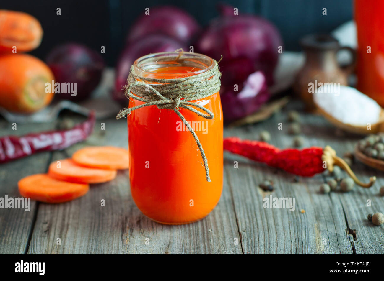 Small glass jar with fresh juice Stock Photo - Alamy
