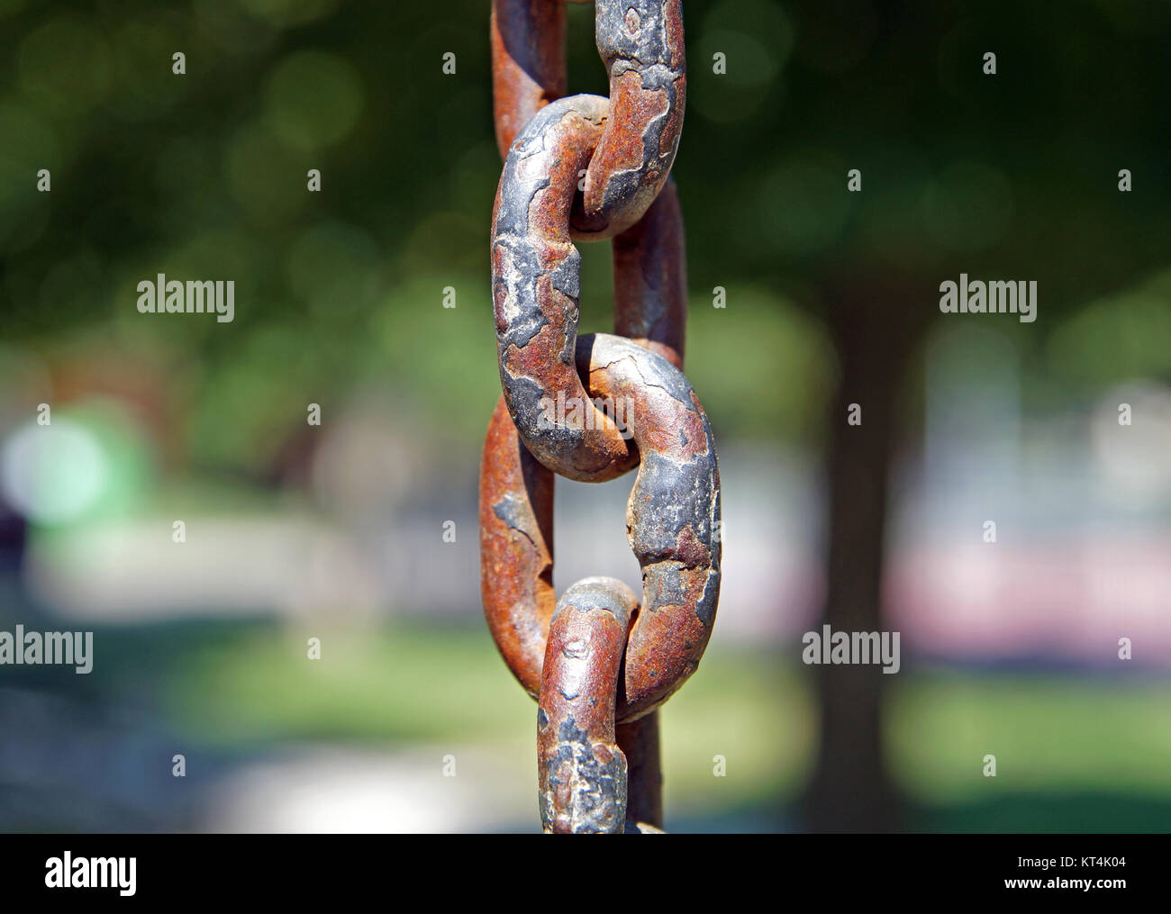 old metal chain on a blurred background Stock Photo - Alamy