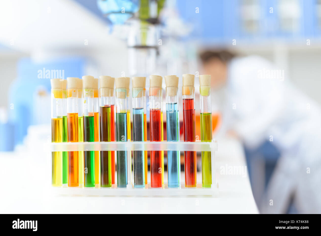 Close-up view of test tubes with reagents on white table in laboratory ...