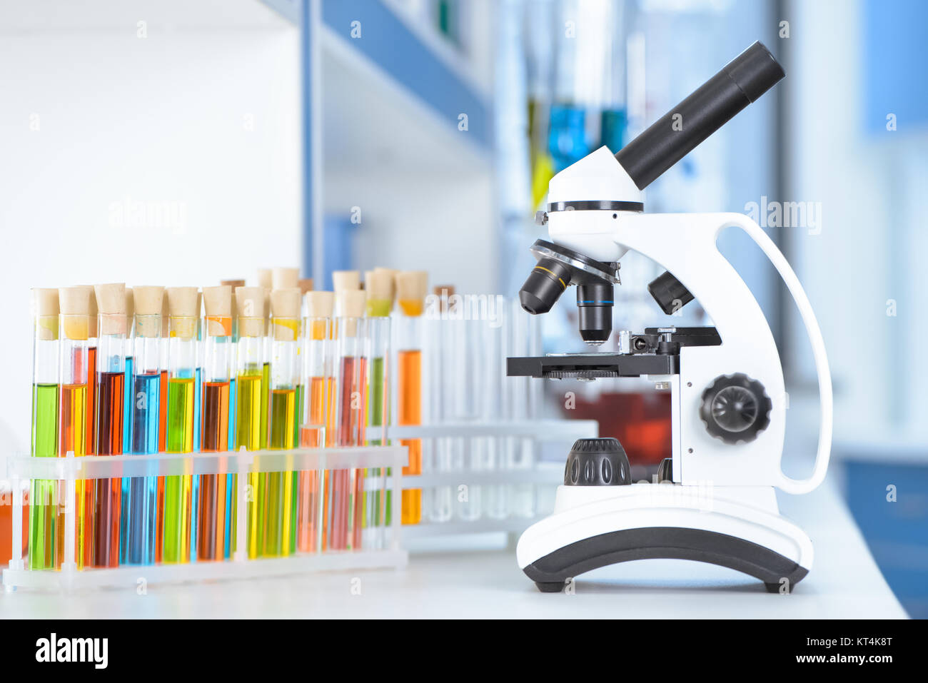 test tubes and microscope on table in laboratory Stock Photo - Alamy
