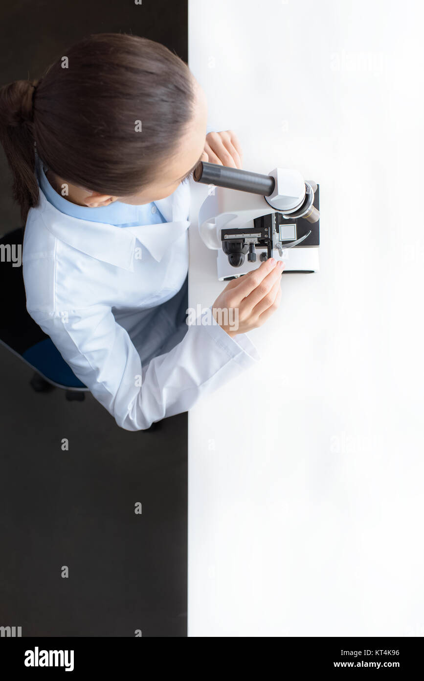 top view of scientist working with microscope in laboratory Stock Photo ...