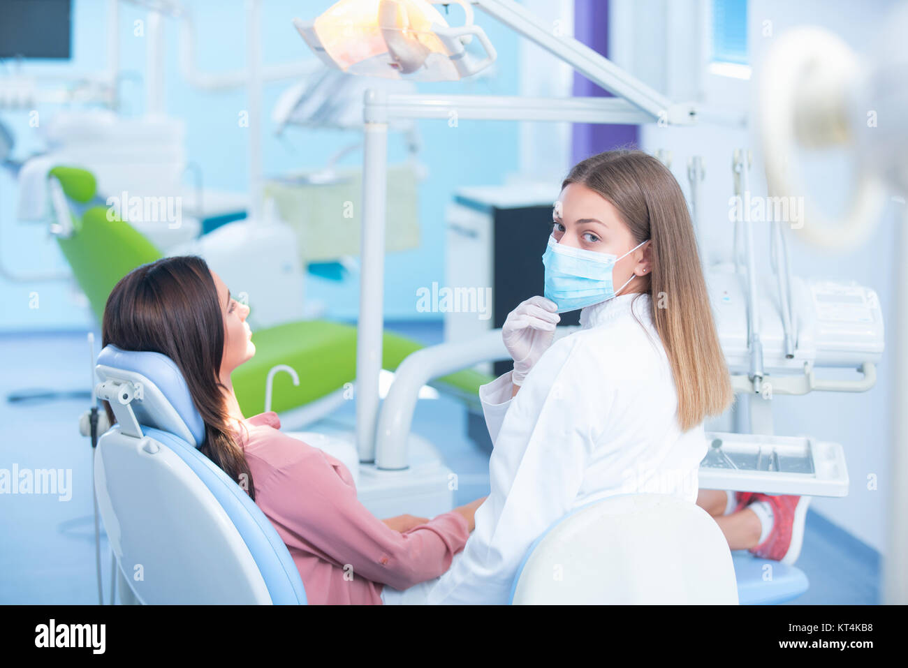 Doctor talking with her patient. Dentist concept Stock Photo - Alamy